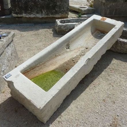 White stone basin - authentic rectangular trough used for horses.