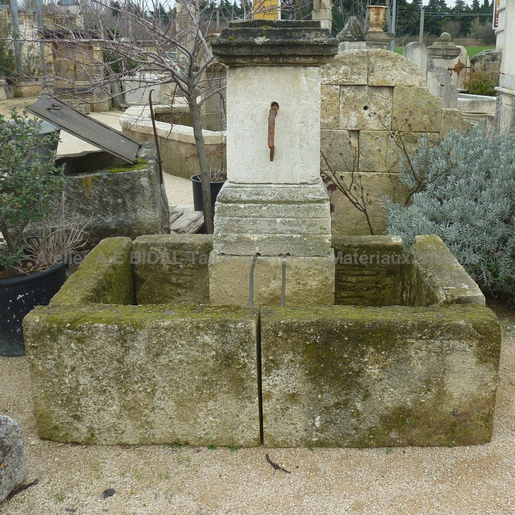 Wall-fountain with molded headpiece and bucket-rest bars